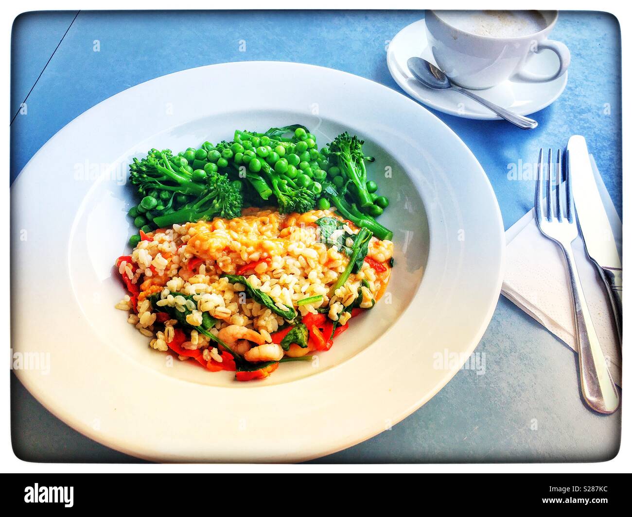 Waitrose Cafe prawn risotto and cappuccino coffee Stock Photo - Alamy