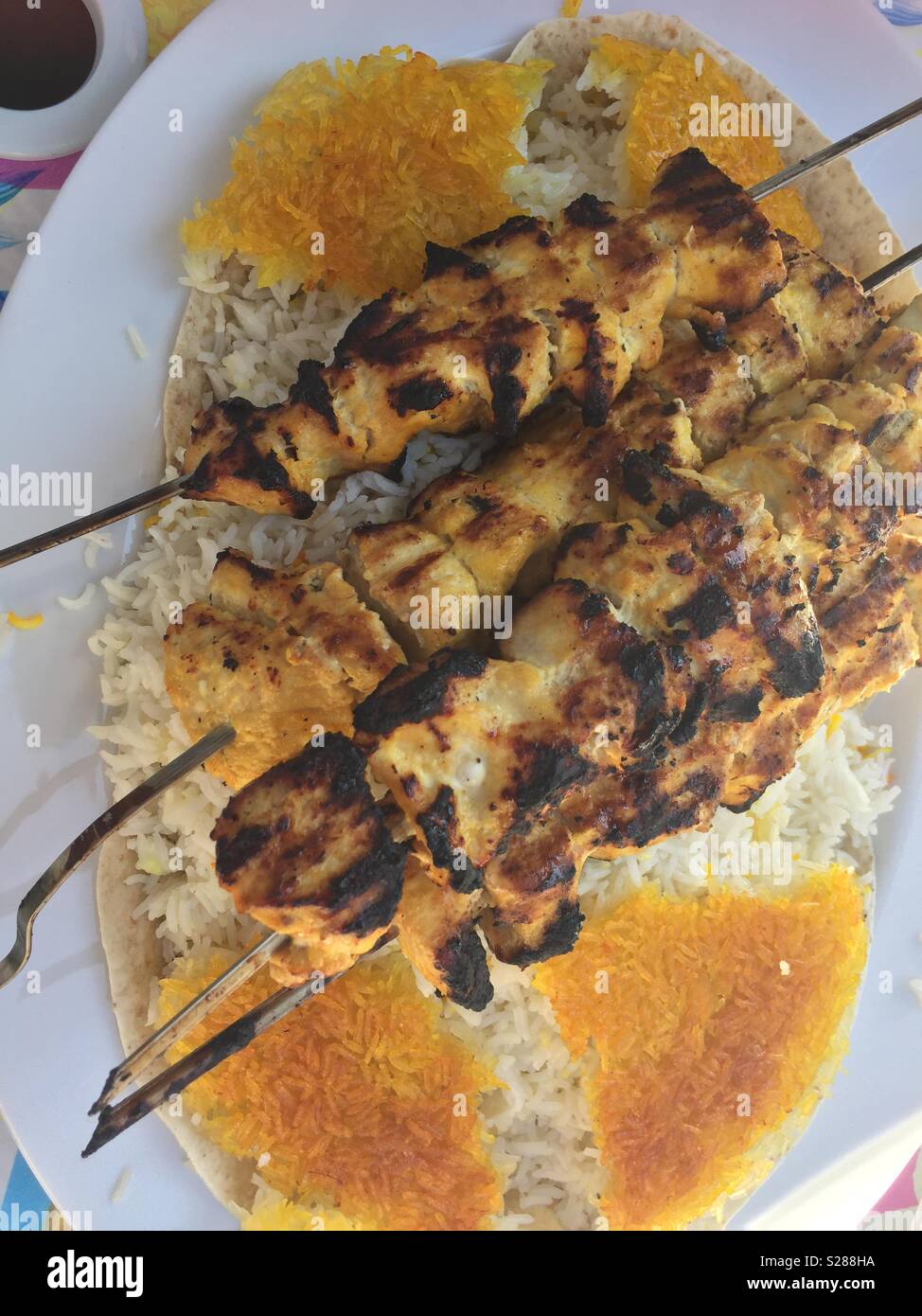 Chicken kebabs and rice Stock Photo - Alamy