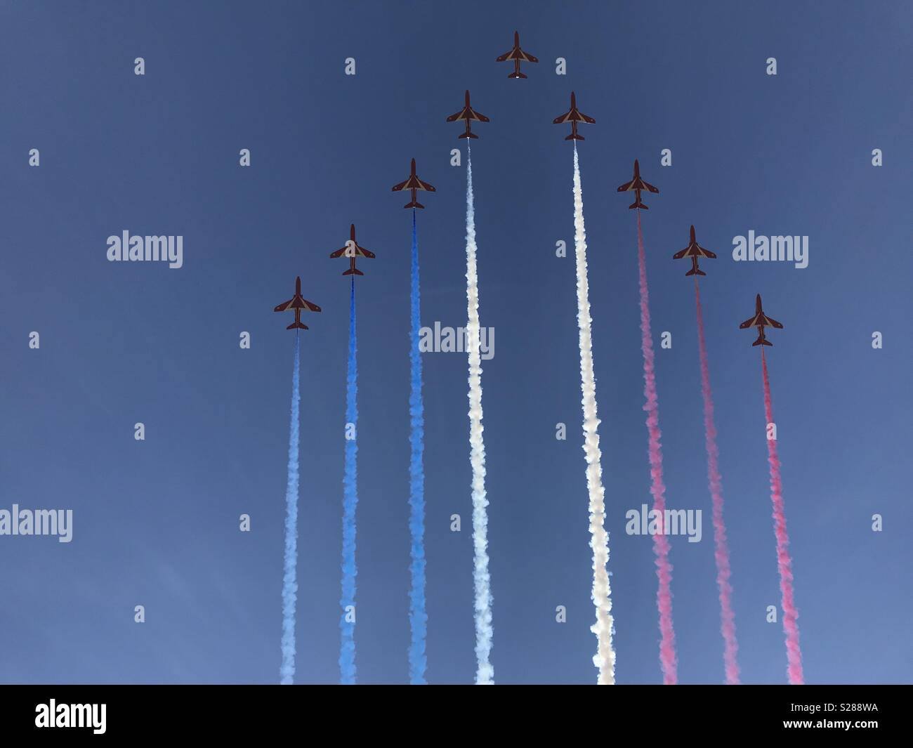 RAF Red Arrows against clear blue sky backdrop Stock Photo - Alamy