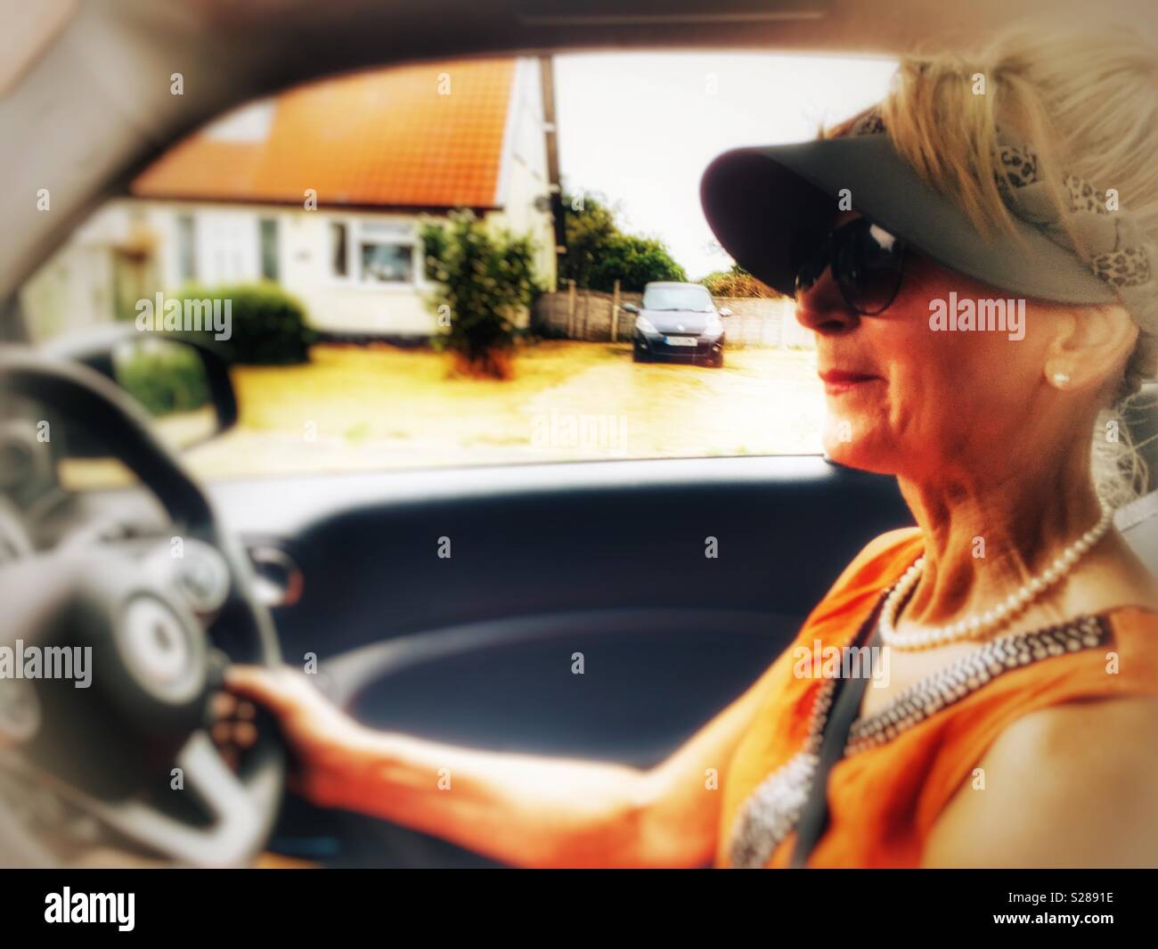 Woman driving car uk hi-res stock photography and images - Alamy