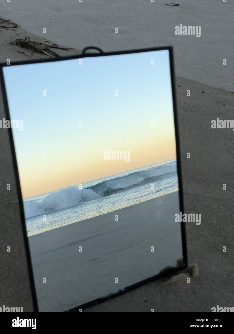 Reflection in a mirror, of the waves at the beach. Australia Stock ...
