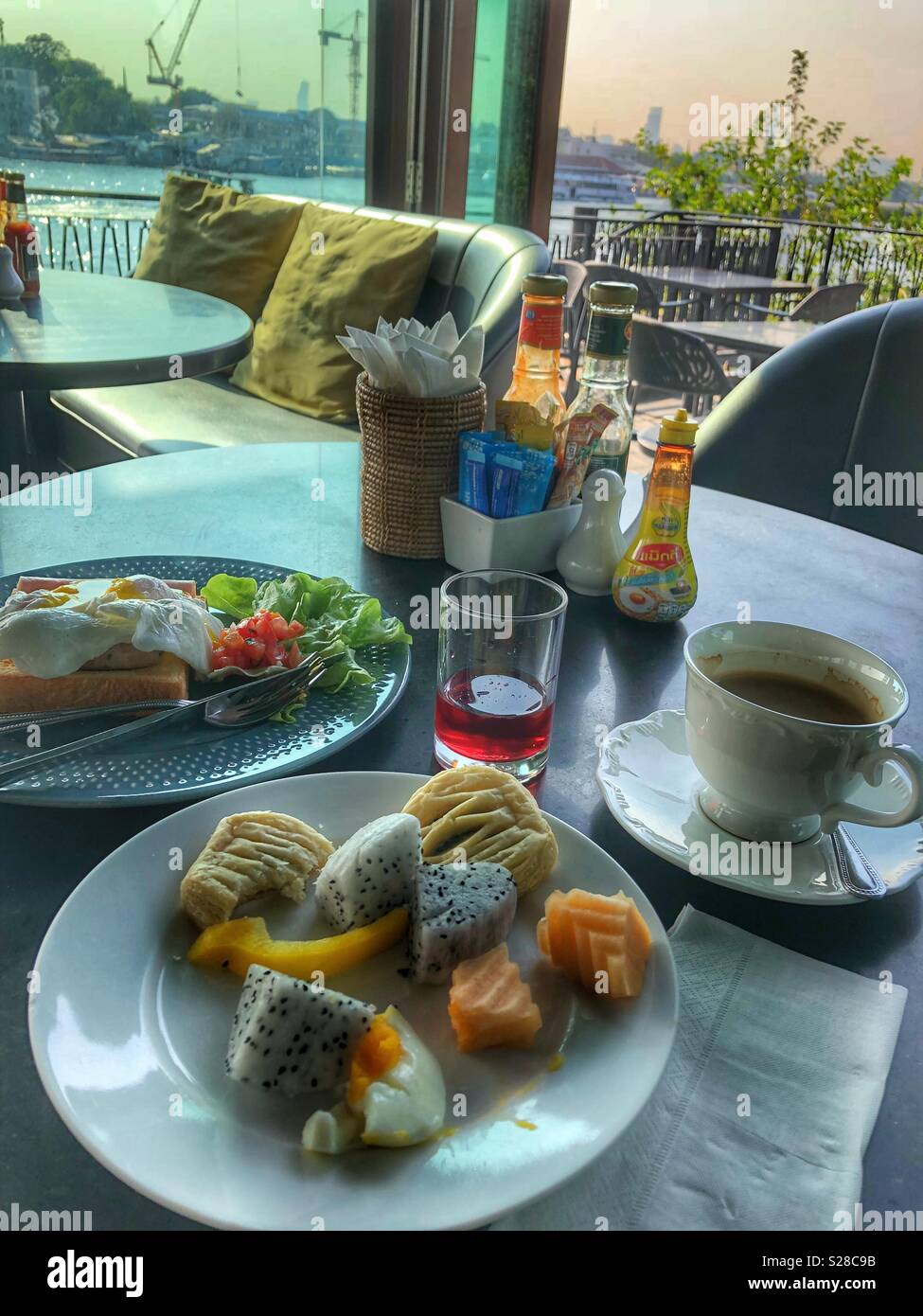 Asian eating breakfast at hotel hi-res stock photography and images - Alamy