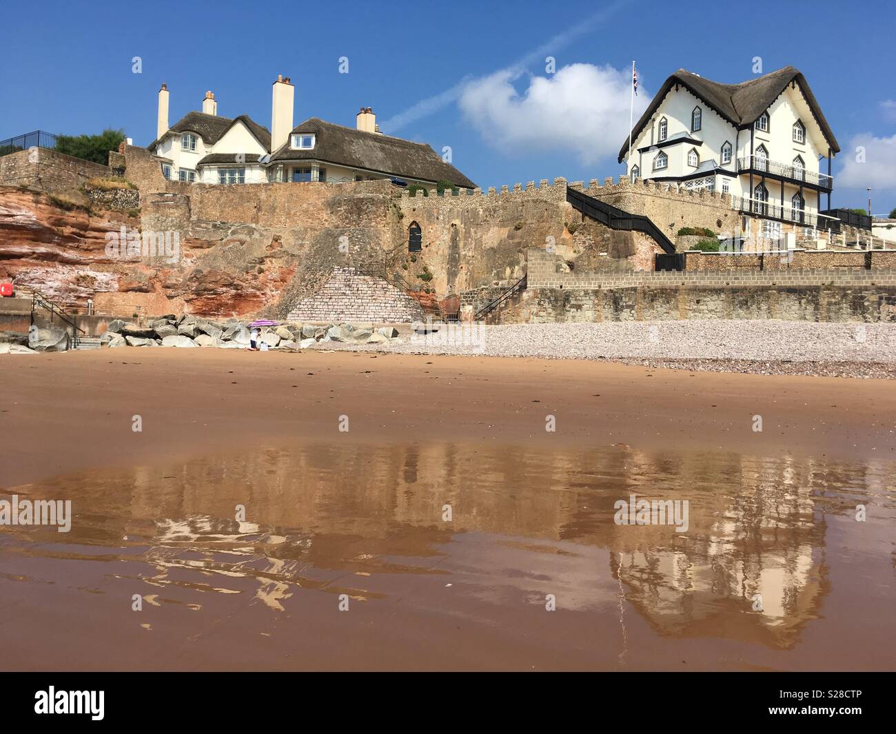 Reflection of houses on beach at Sidmouth, Devon Stock Photo - Alamy