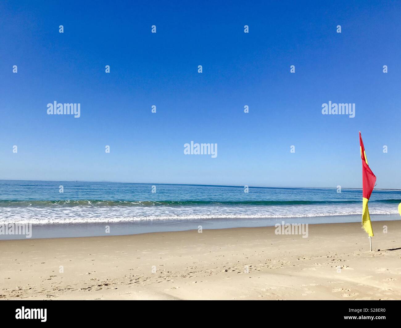 Yellow beach warning flag hi-res stock photography and images - Alamy
