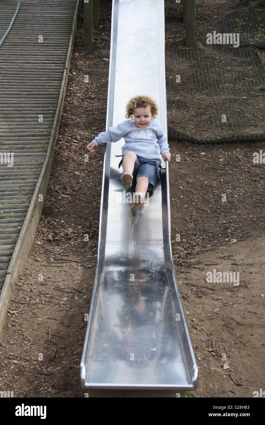 Girl Coming Down Slide Stock Photos & Girl Coming Down Slide Stock ...