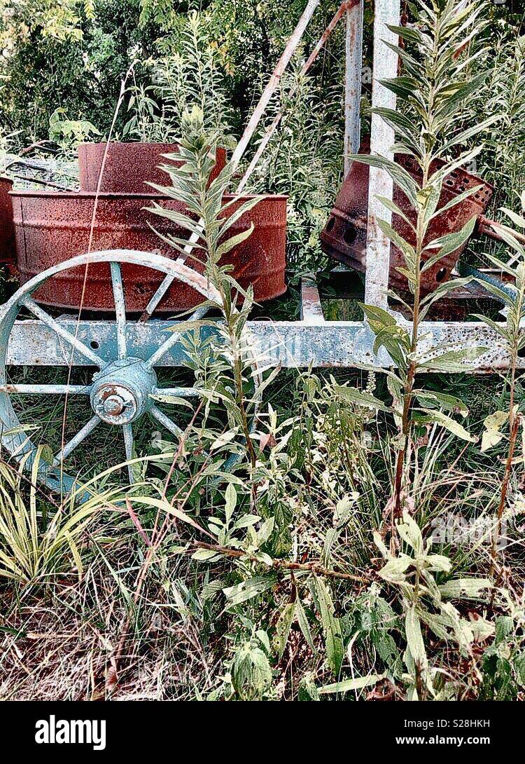 Iron things left in a field to rust Stock Photo - Alamy