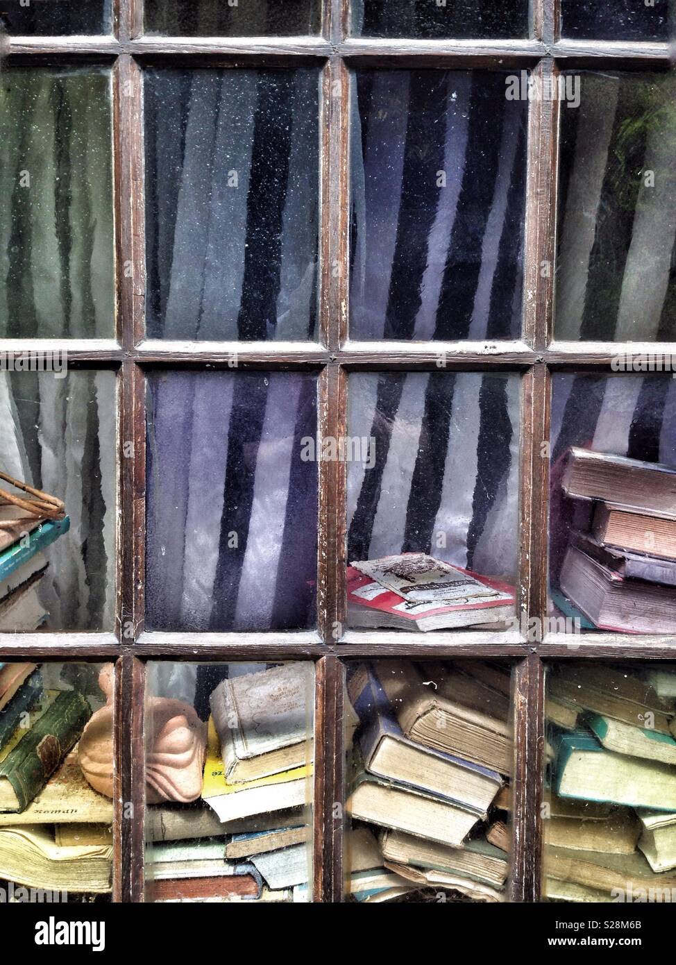 Old books behind the window of a book store Stock Photo - Alamy