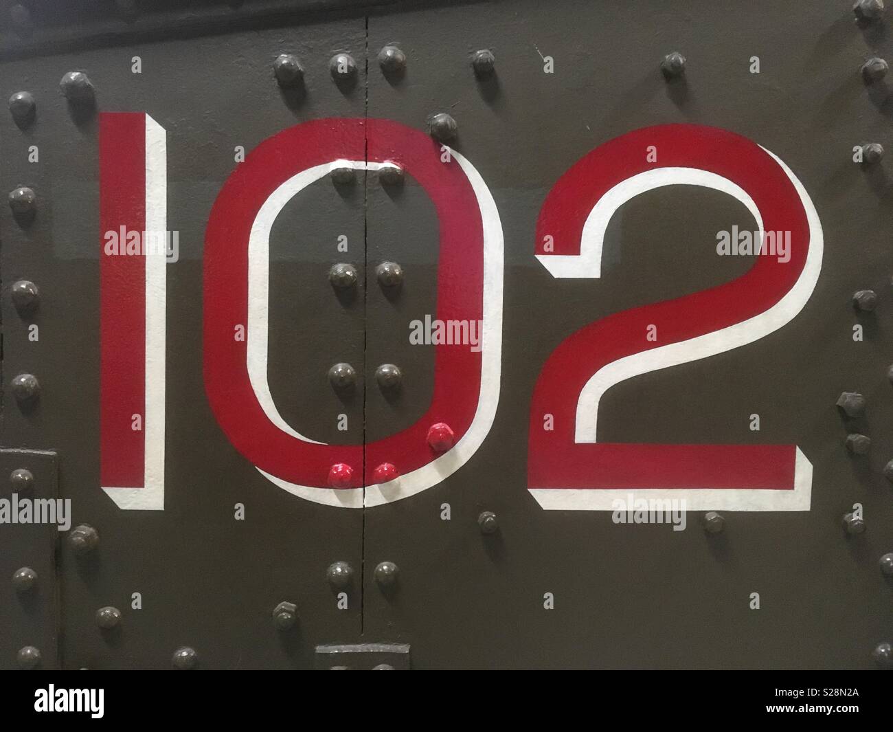Numbers on a tank Stock Photo - Alamy