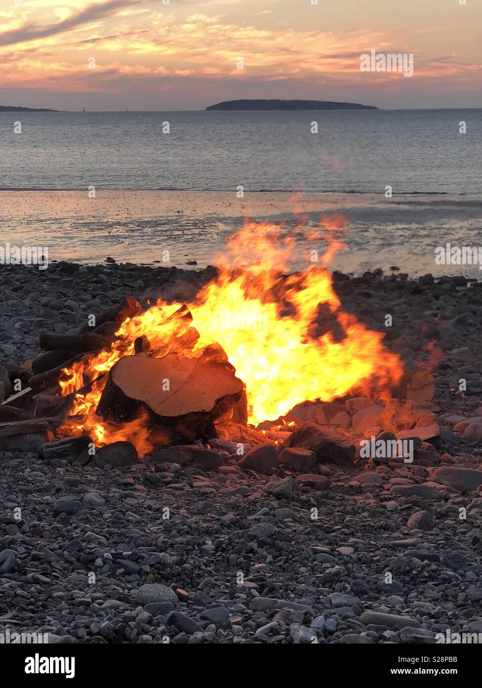 Fire on the beach Stock Photo - Alamy