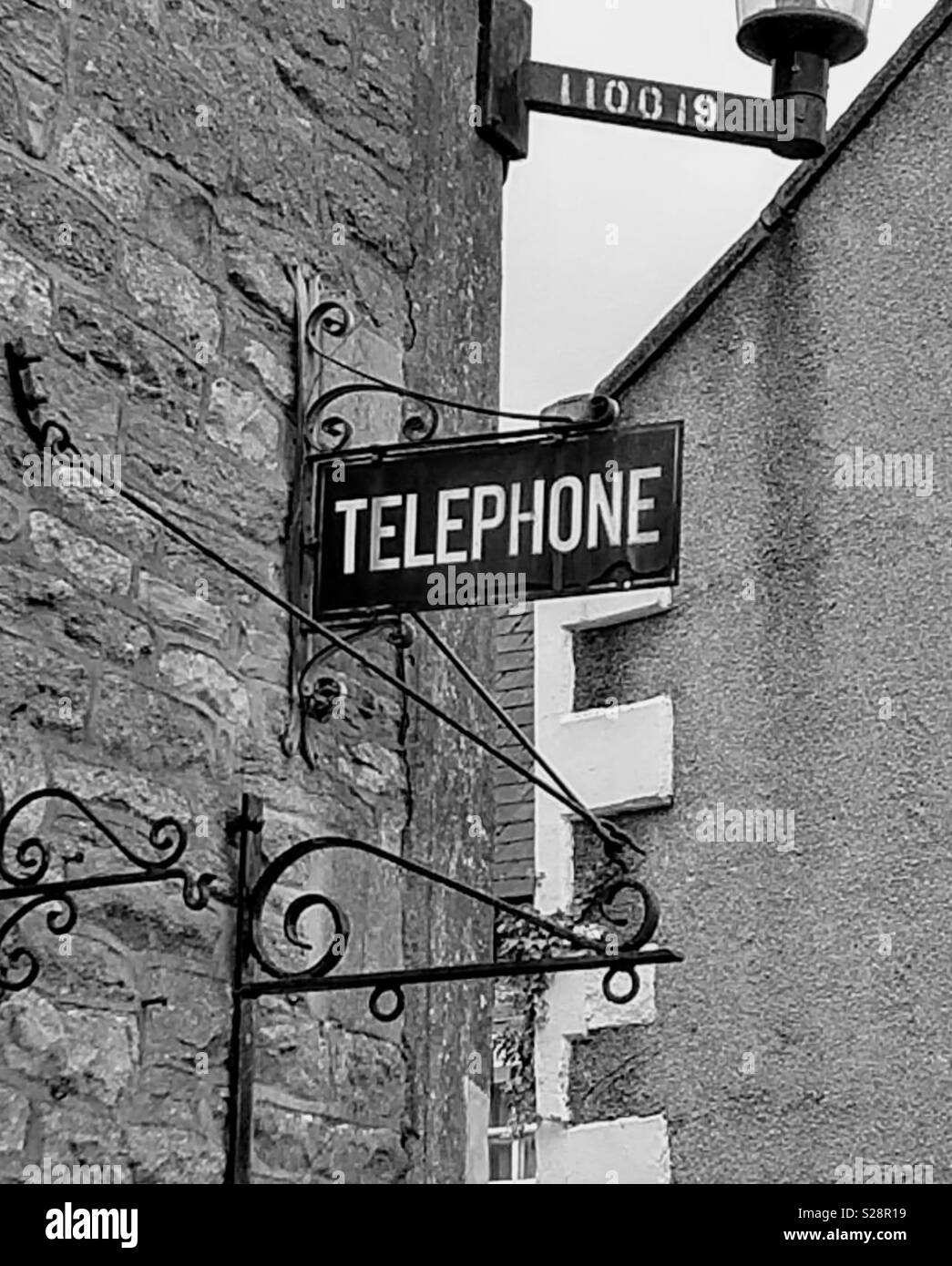 Old telephone on wall Black and White Stock Photos & Images - Alamy