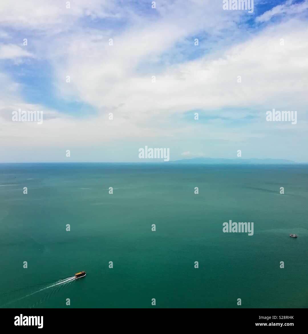 Island tour boat moving through Thai ocean, Koh Phan Gan, Thailand ...