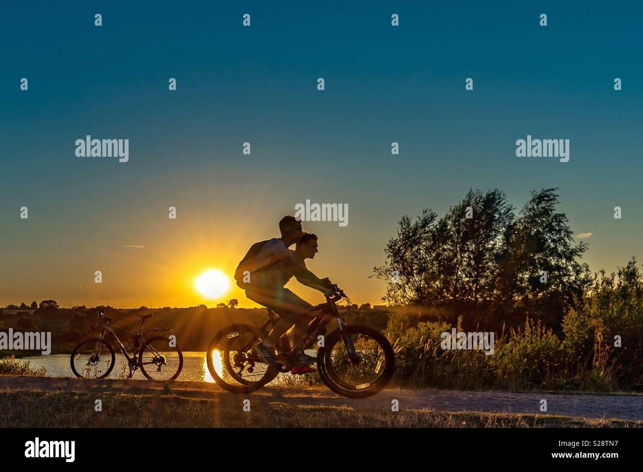 Sunset cycle ride Stock Photo - Alamy