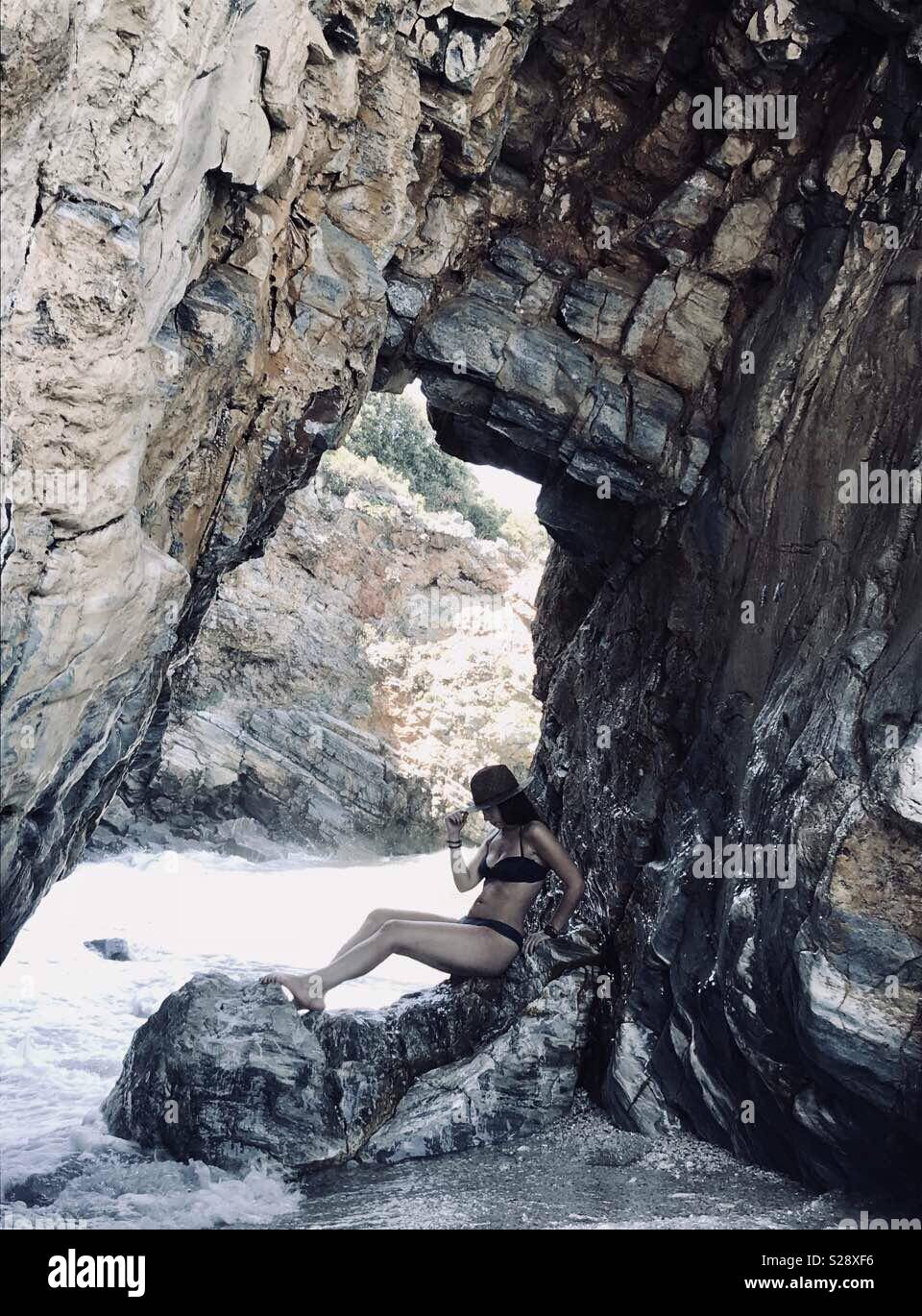 Girl in rocks Stock Photo - Alamy
