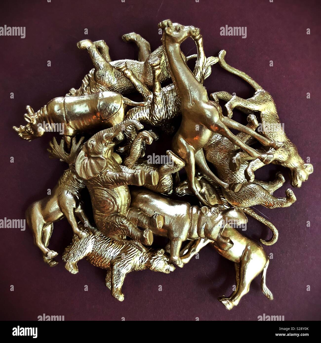 A pile of gold animal figurines Stock Photo - Alamy