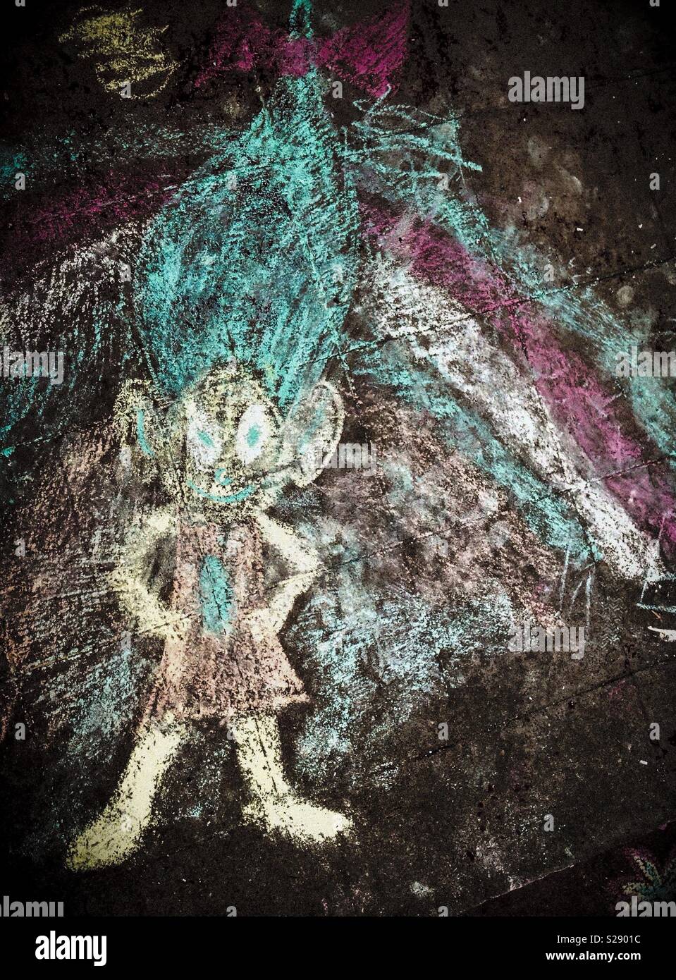 Darkened photo of chalk drawn troll and rainbow on porch cement Stock ...