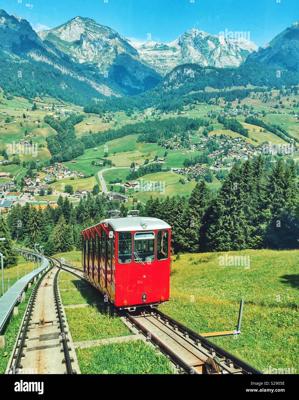 Red train on the Ilsios funicular railway, Switzerland Stock Photo - Alamy