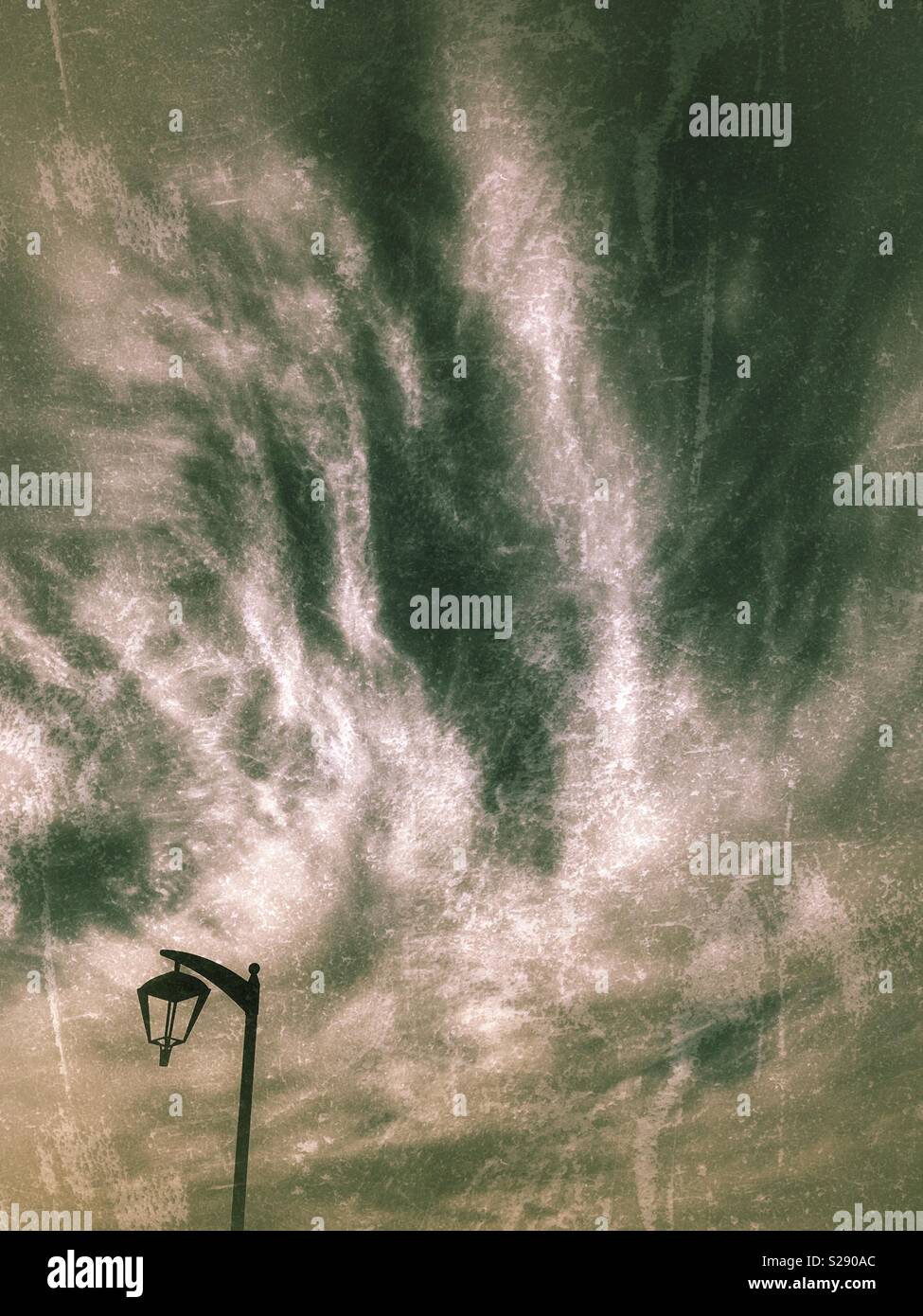 Street lamp with a cloud mesh Stock Photo - Alamy