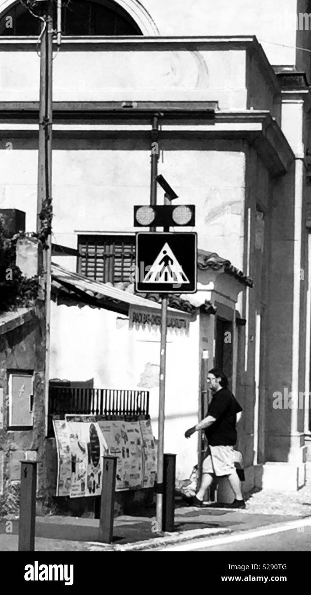 Man crossing road crossing Black and White Stock Photos & Images - Alamy