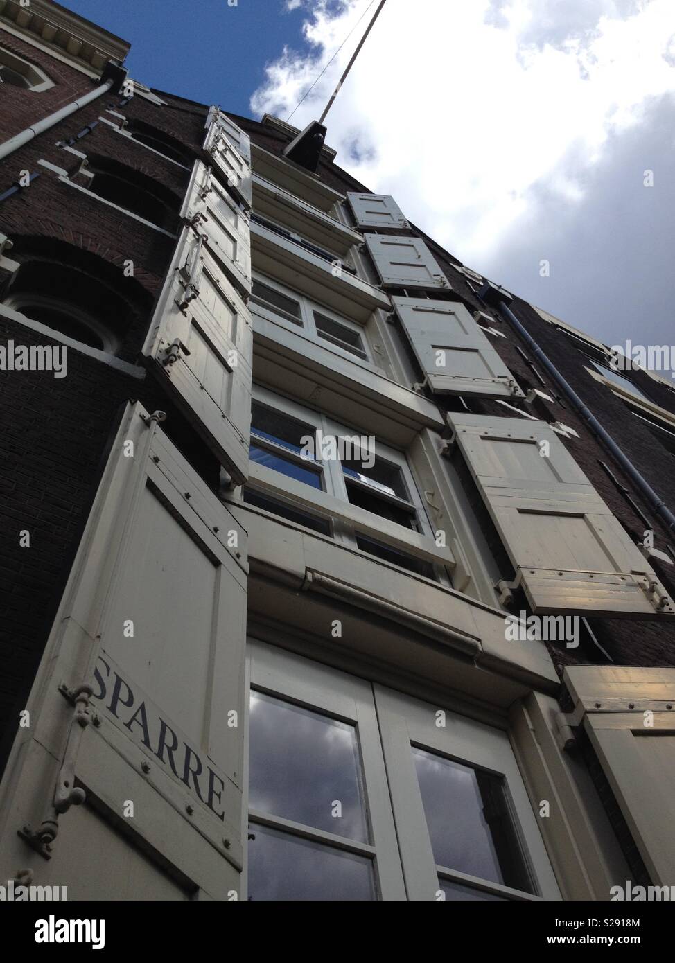 Canal side buildings in Amsterdam Stock Photo - Alamy