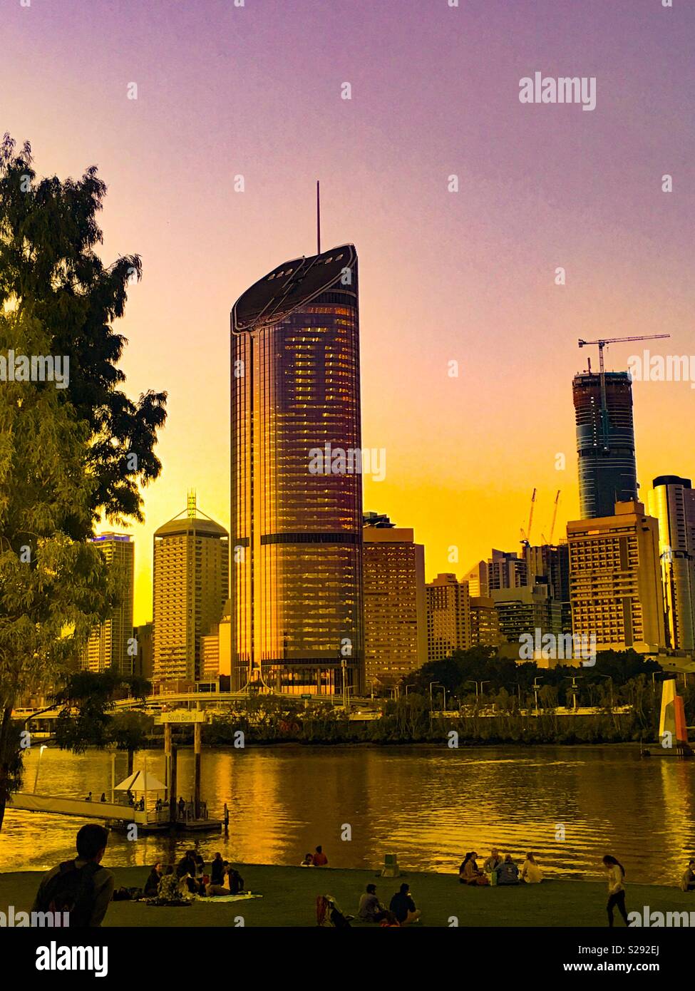 Brisbane City skyline at dusk with river frontage Stock Photo - Alamy
