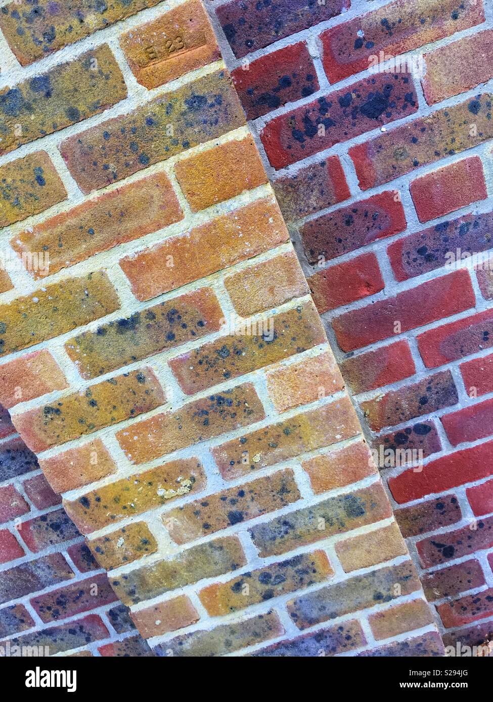 Multicoloured brick wall angled Stock Photo - Alamy