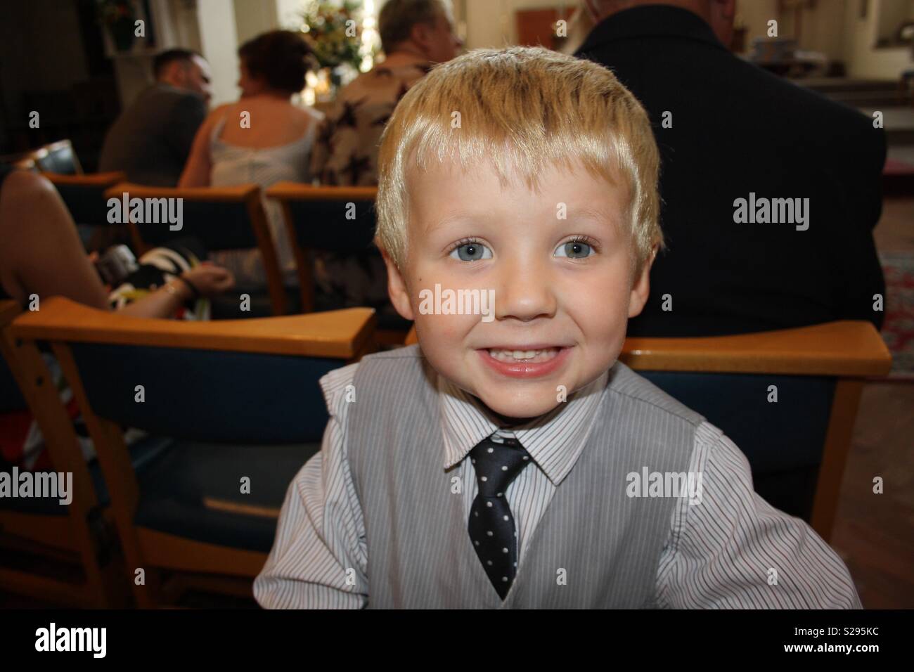 Little boy dressed smart in a church Stock Photo - Alamy