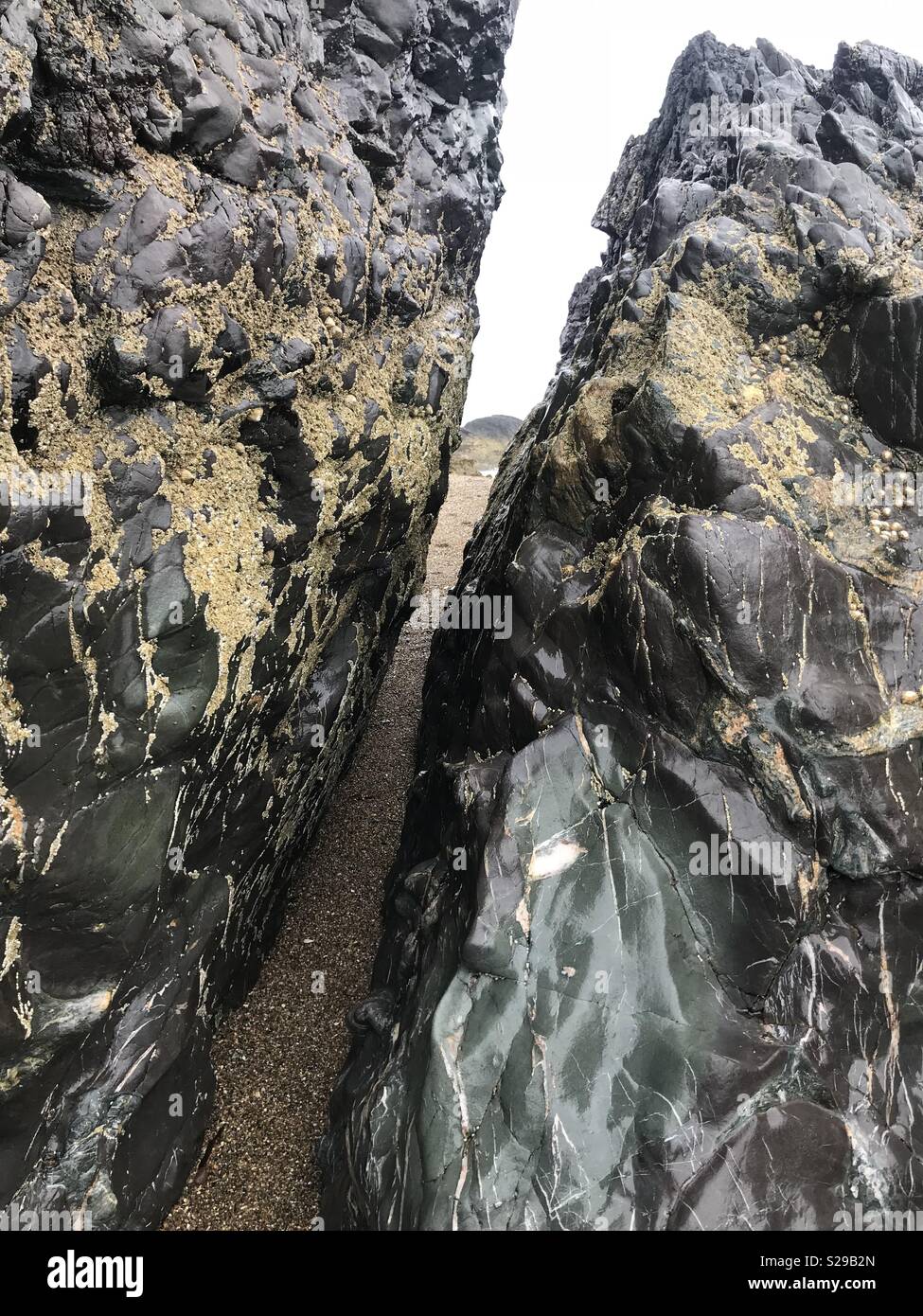 Crack in the rocks Stock Photo - Alamy