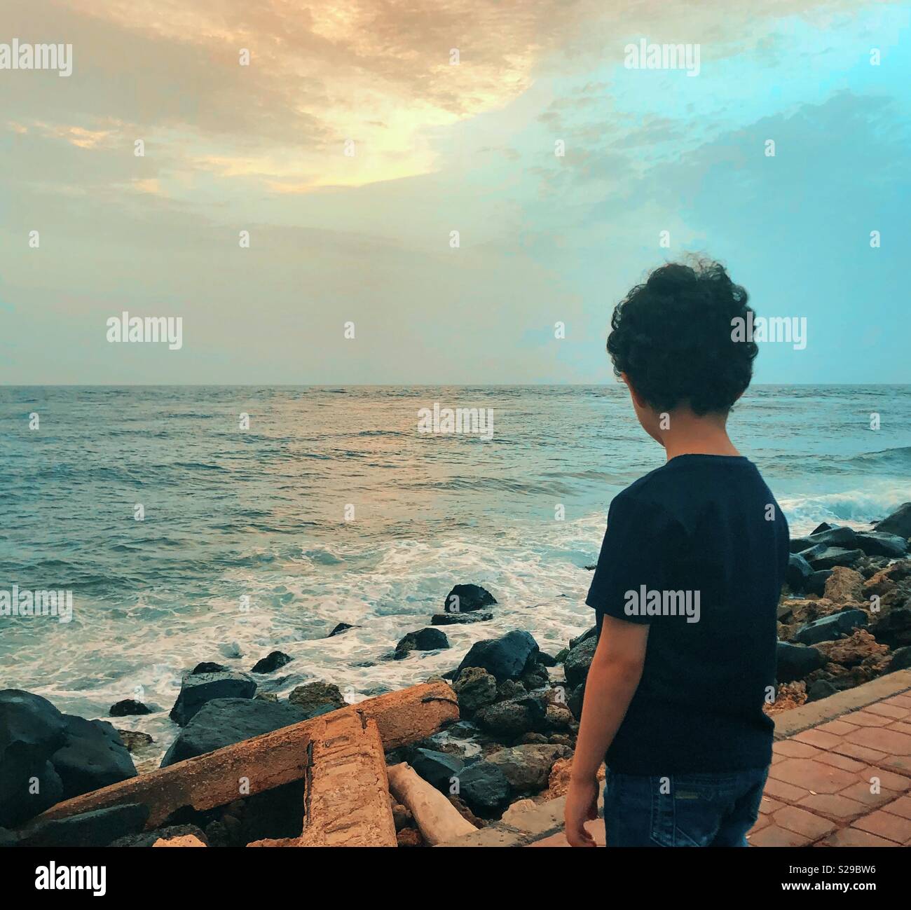 Boy Watching Sea Sunset High Resolution Stock Photography and Images ...
