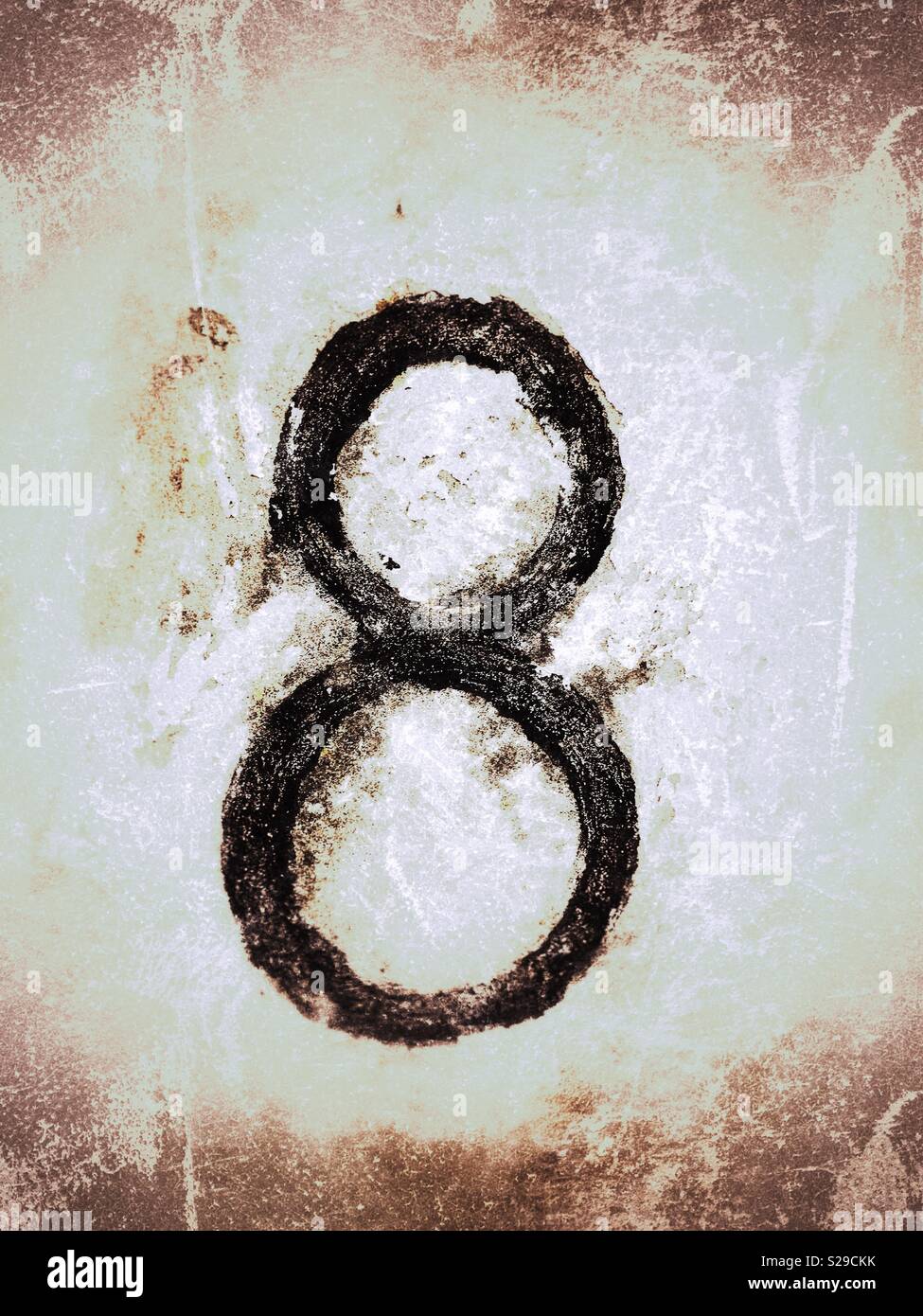 8 scratched into a metal surface which is white and rusty colour Stock ...