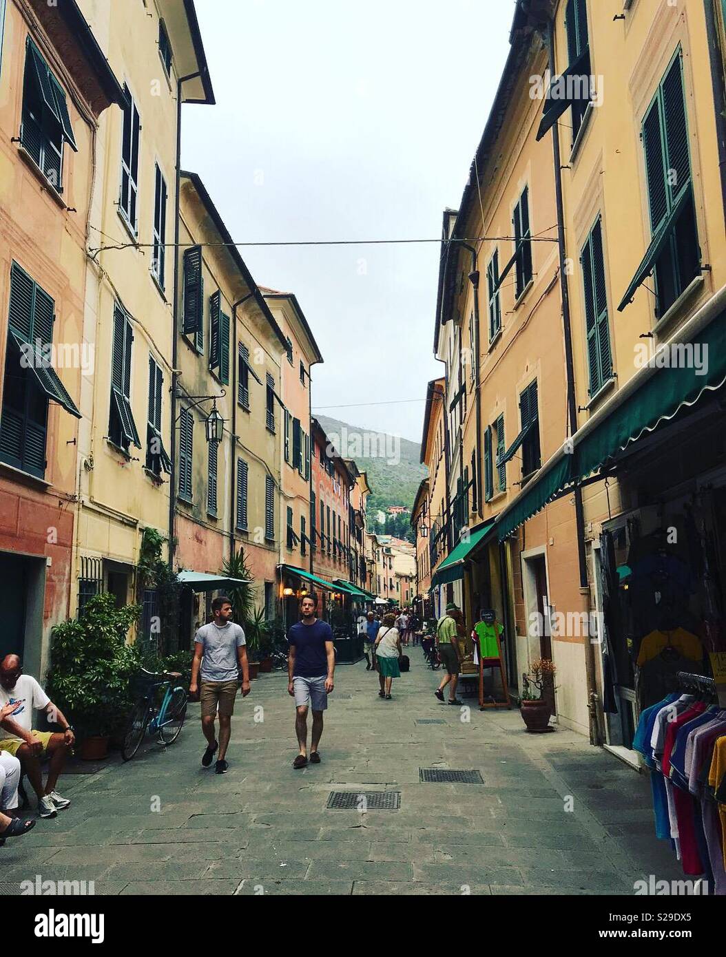 Walking in alley of small Italian shops Stock Photo - Alamy