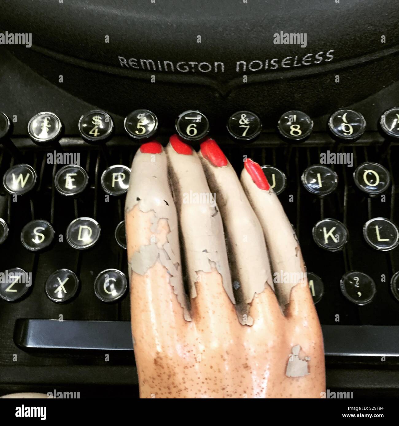Creepy hand & typewriter Stock Photo - Alamy