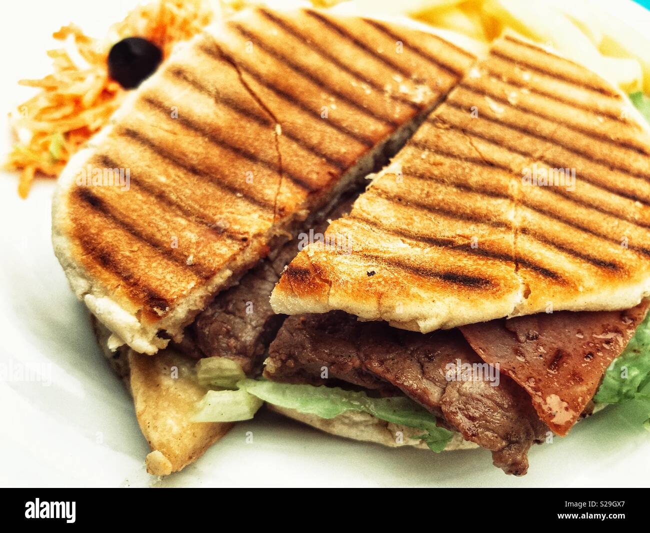 Toasted steak sandwich with traditional bolo bread, Madeira Stock Photo ...