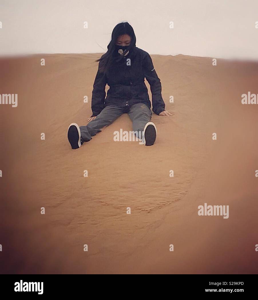 Sand sliding in Northwestern China, Tengeli Desert,with a mask Stock ...