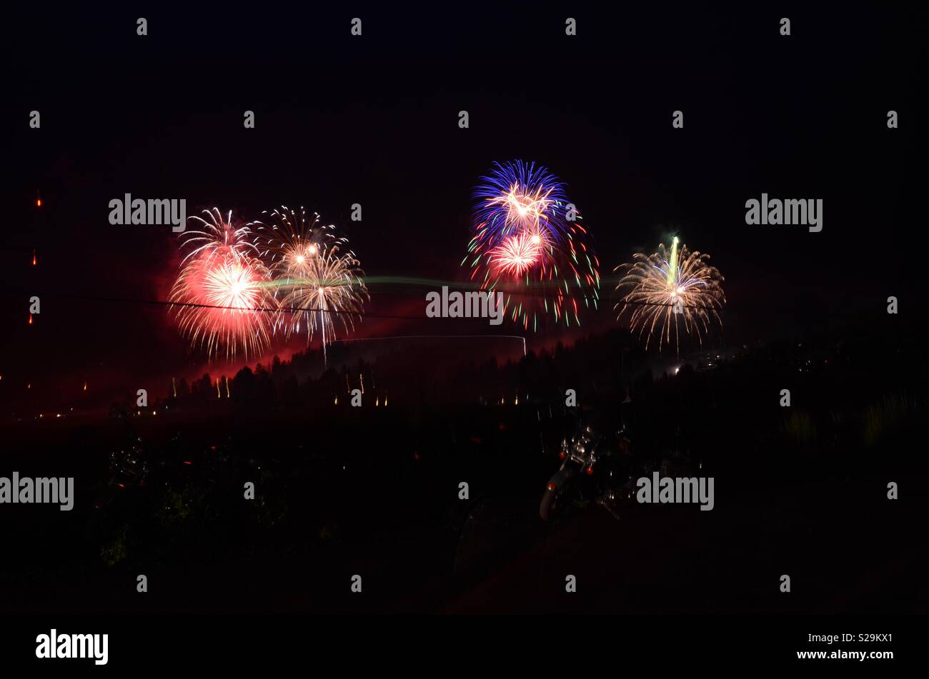 Fireworks and a faint silhouette of a motorbike Stock Photo - Alamy