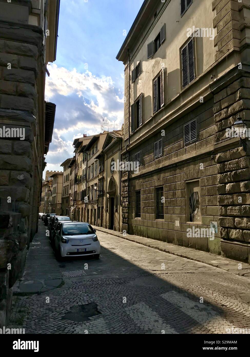 A Typical Street in Florence Italy with Stone Paved Road and Tall Stone ...