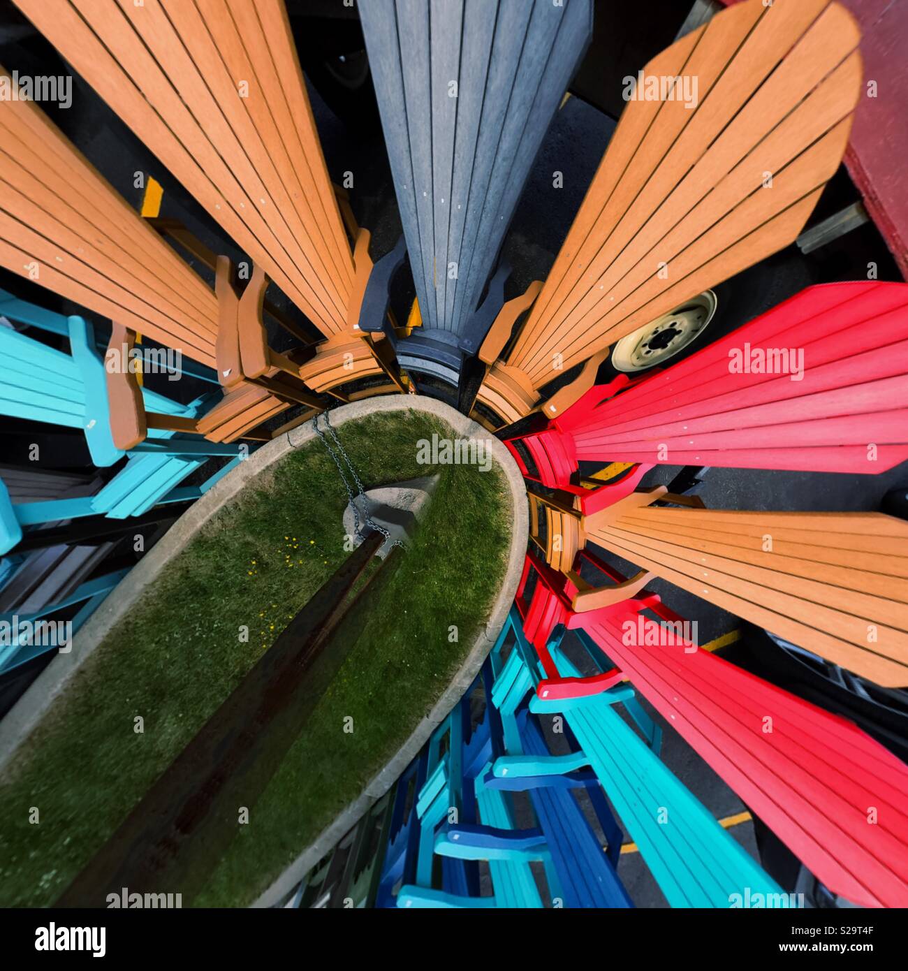 Adirondack chairs around an oval Stock Photo - Alamy