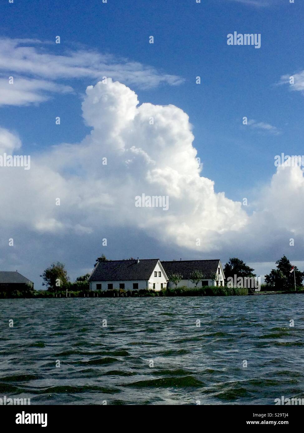 Boat shed on water Stock Photo - Alamy
