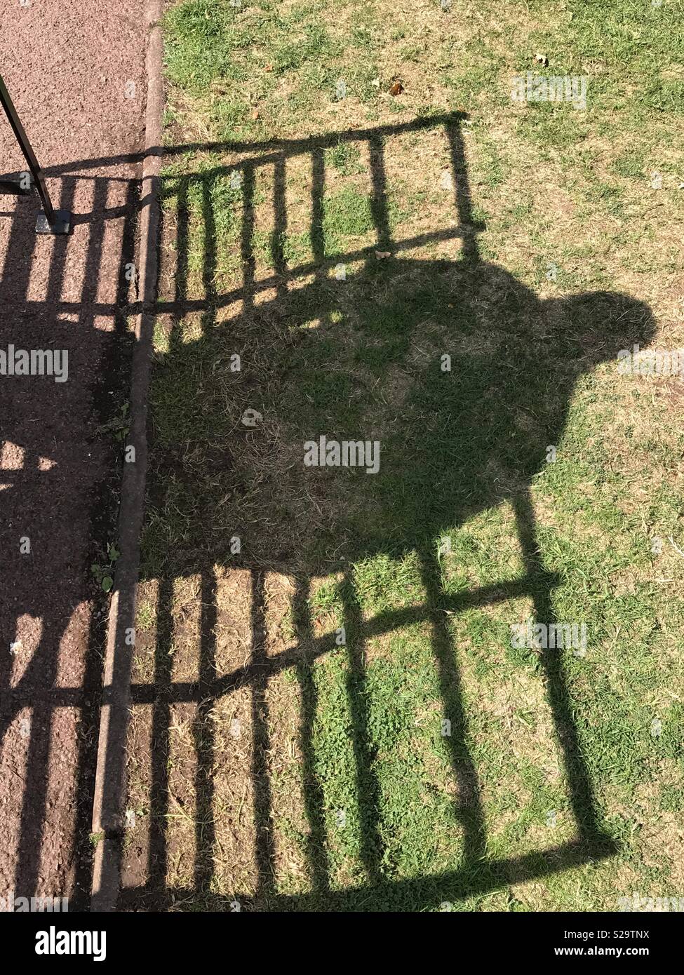 Shadow on a bench Stock Photo - Alamy