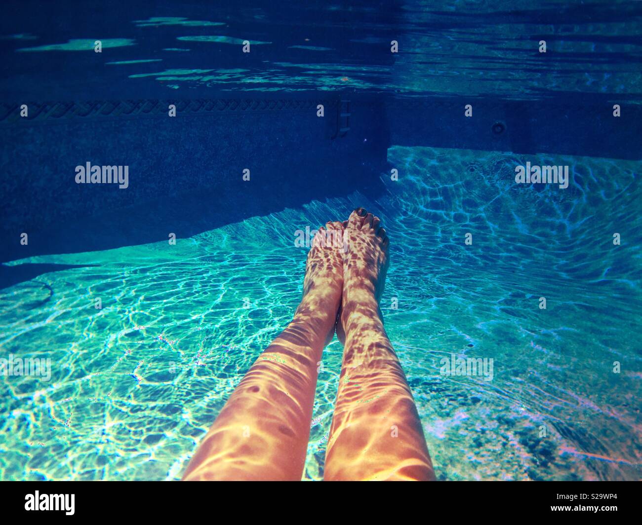 Woman legs underwater pool hi-res stock photography and images - Alamy