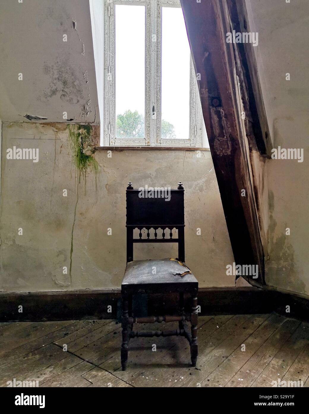 Rundown chair in old castle Stock Photo - Alamy