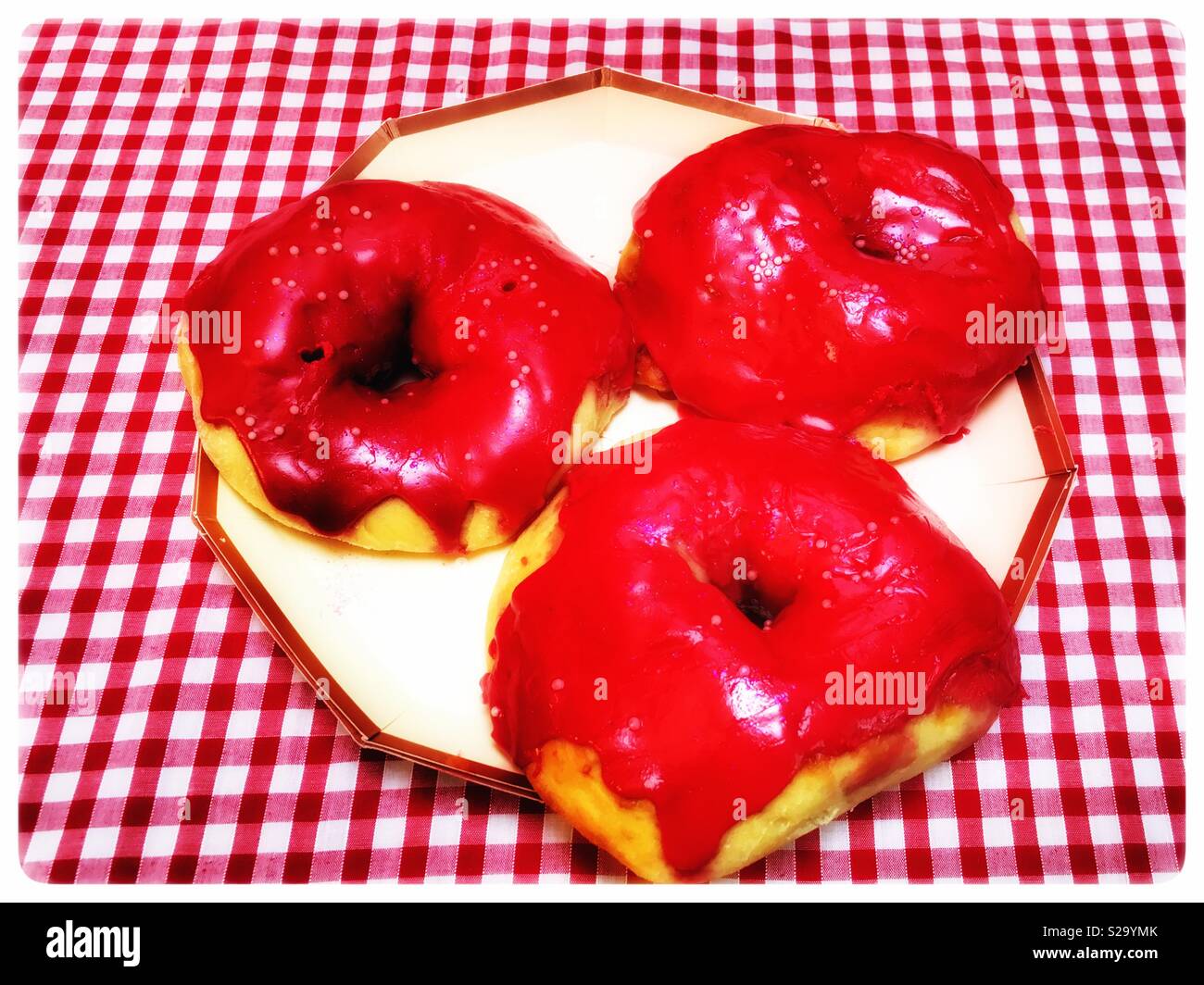 Homemade ring doughnuts with strawberry flavoured cream Stock Photo - Alamy