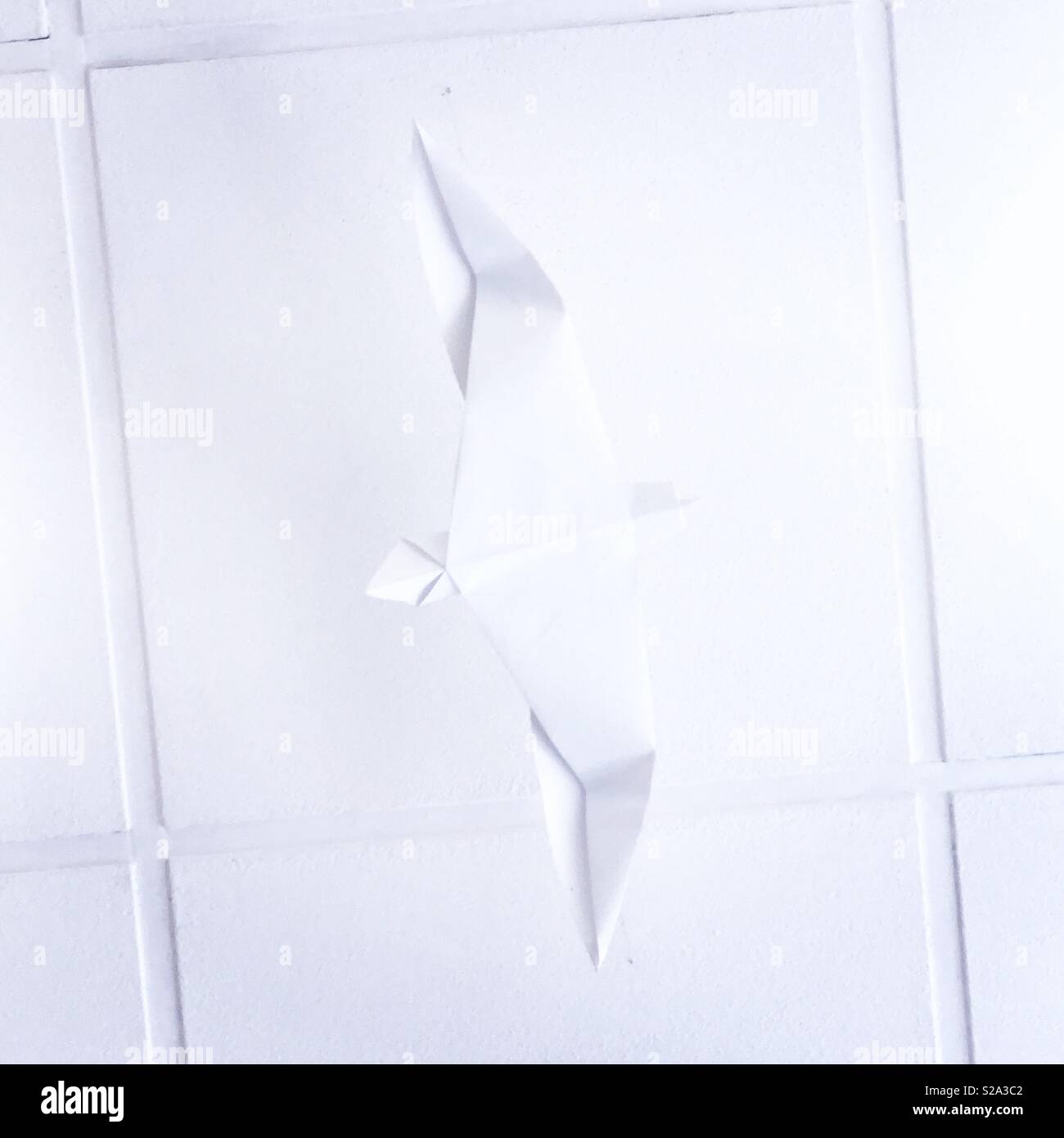 White origami crane hanging from ceiling Stock Photo - Alamy