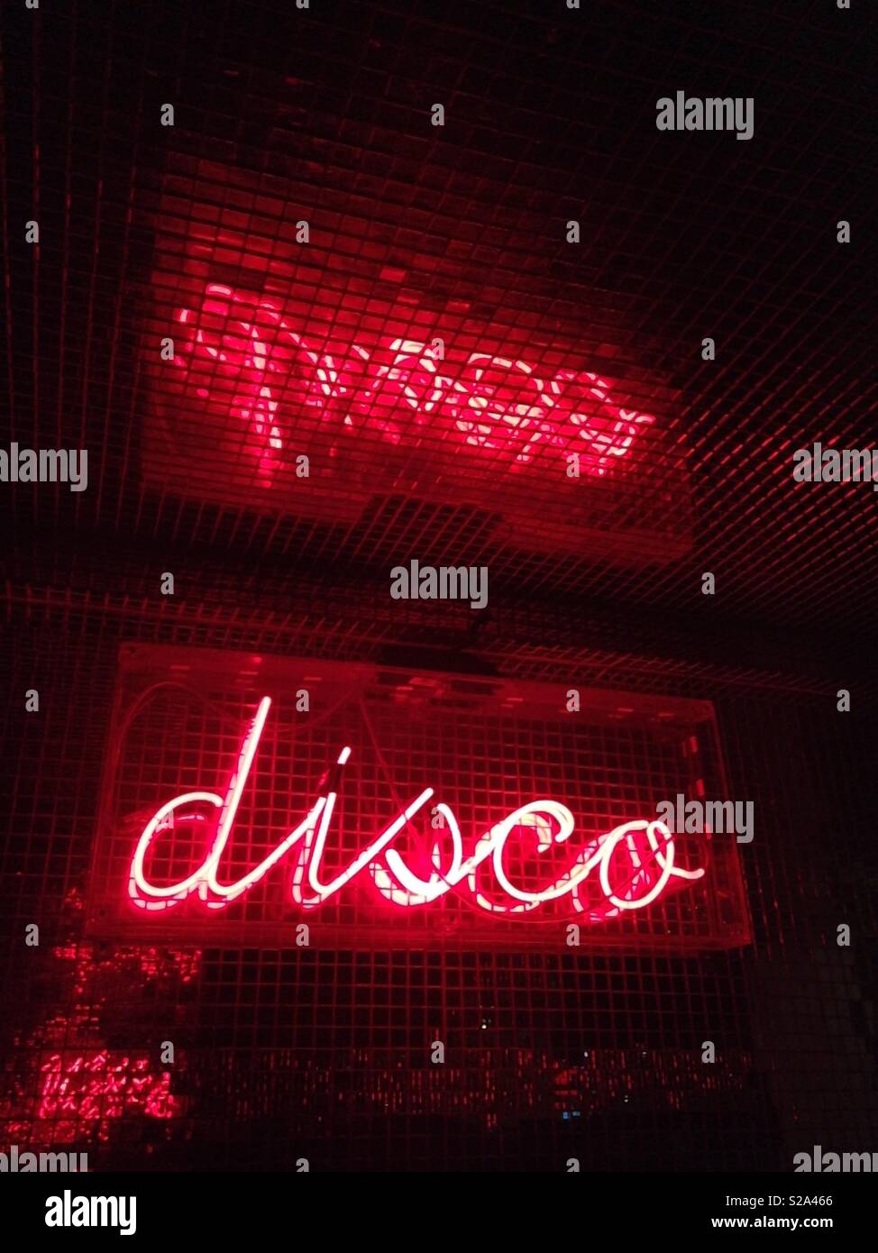 Disco neon sign in a club, Manchester Stock Photo - Alamy