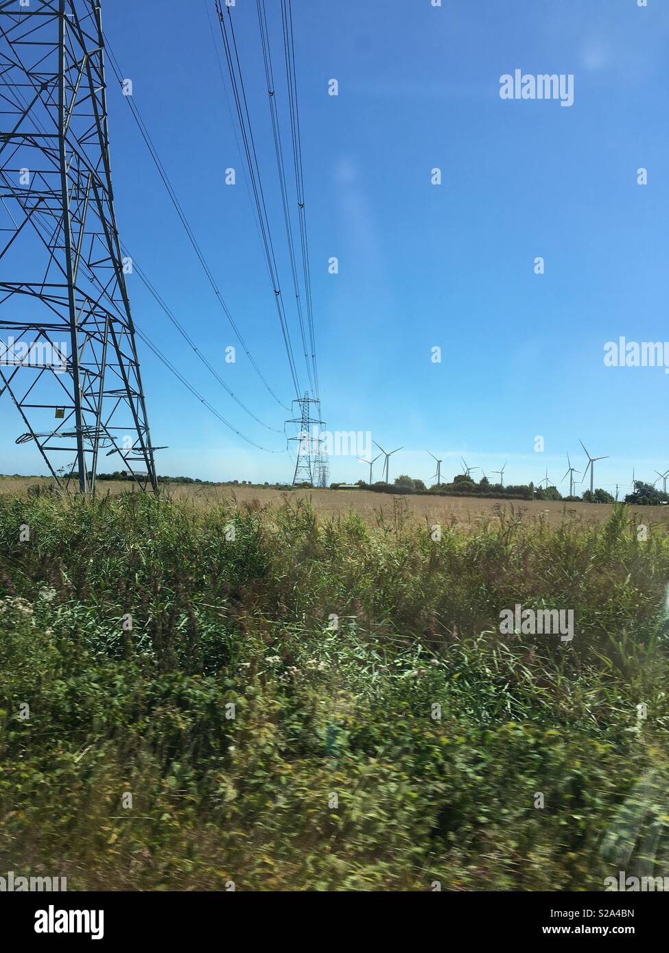 Power lines and wind turbines Stock Photo - Alamy