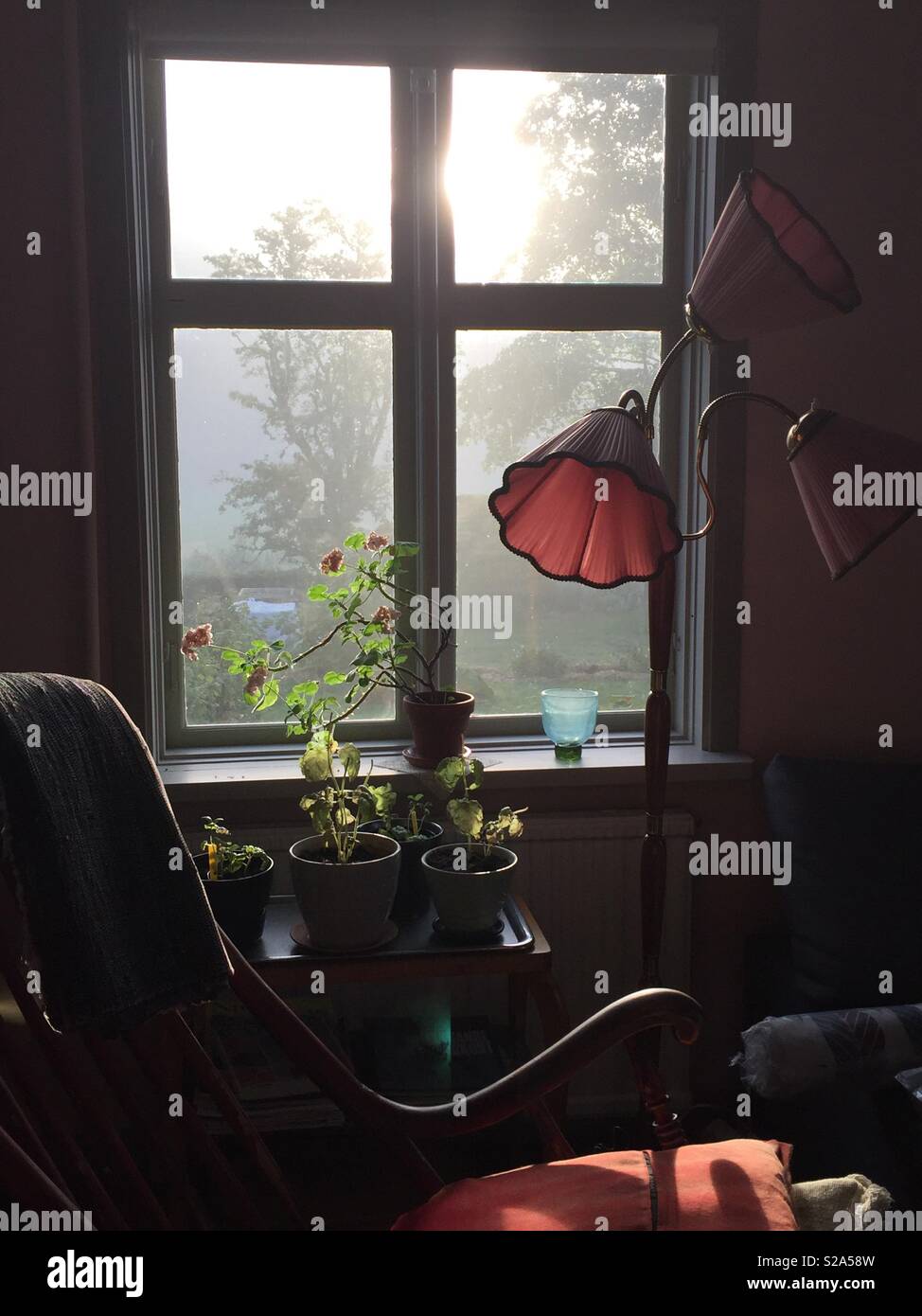 Dawn through window Stock Photo - Alamy