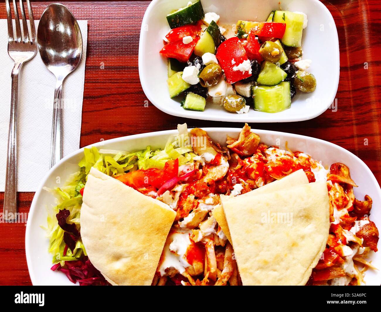 A meal of shawarma and Greek salad Stock Photo - Alamy
