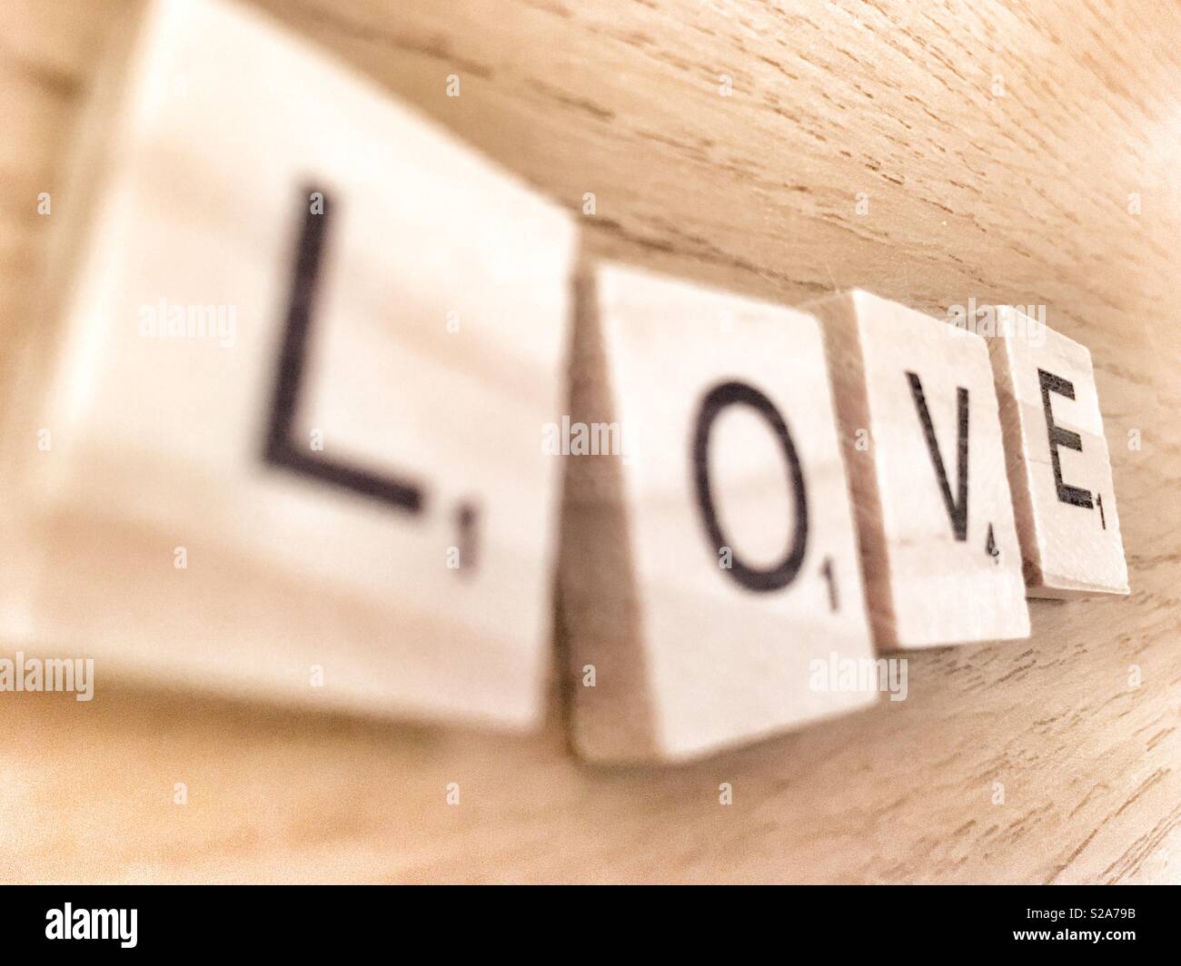 The word love written with scrabble tiles Stock Photo - Alamy