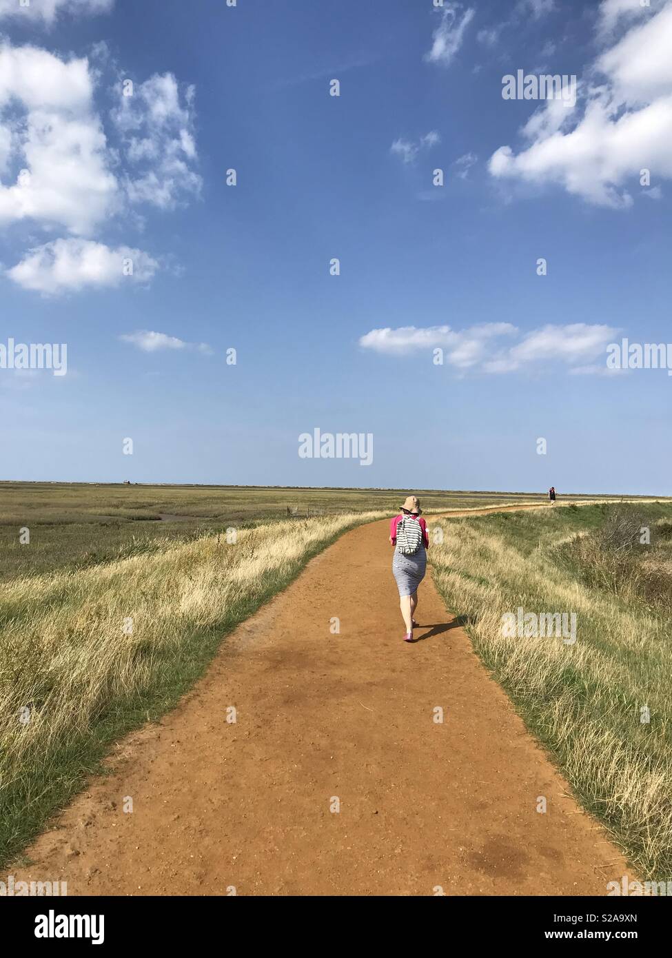 Woman walking on path Stock Photo - Alamy