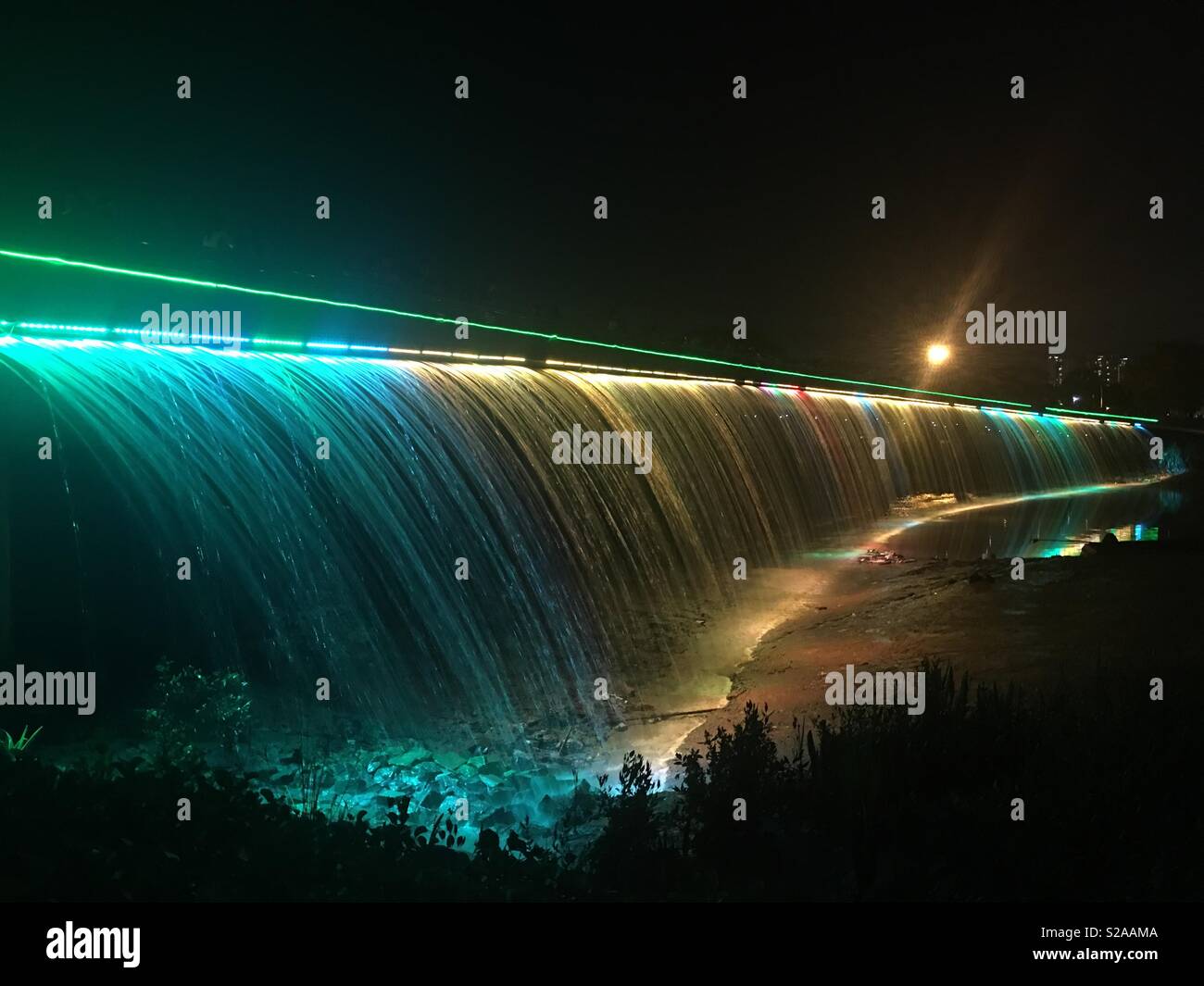 Long Rainbow fountain Stock Photo - Alamy