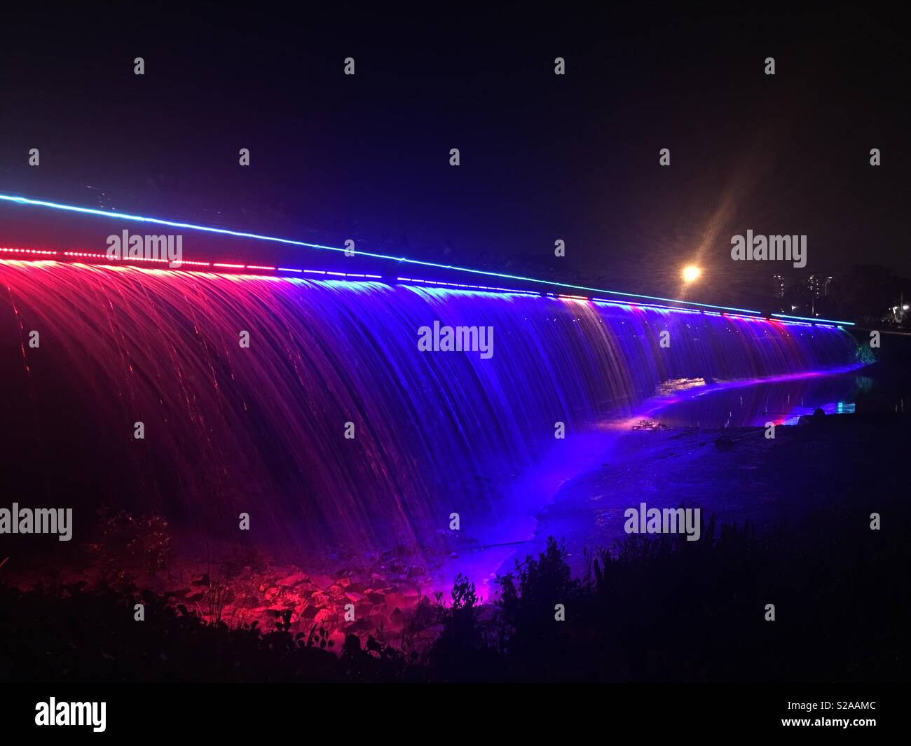 Long rainbow fountain Stock Photo - Alamy